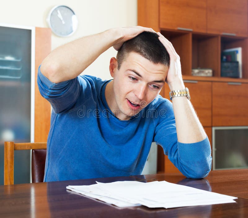 Sad Shocked Guy Looking at Document at Home Stock Image - Image of ...