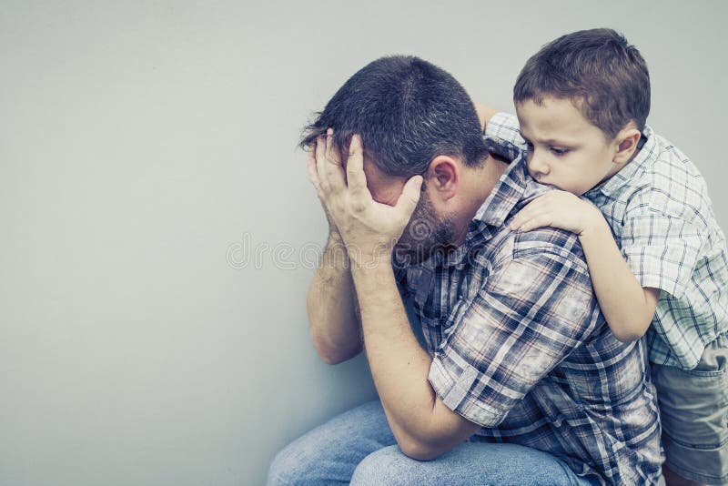 Sad Son Hugging His Dad Near Wall Stock Photo - Image of crying, child ...