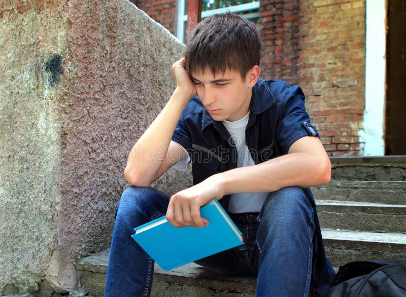 Sad Student with a Book stock image. Image of outcast - 69479459