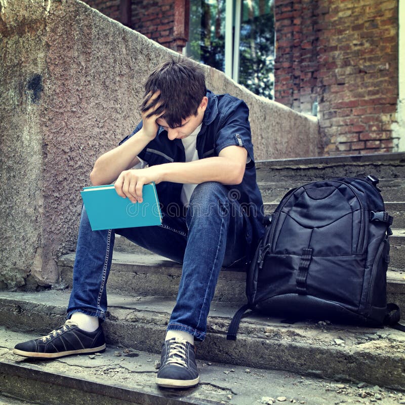 Sad Student with the Book stock image. Image of problem - 52476877