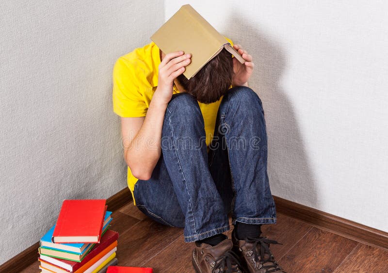 Sad Student with a Books stock photo. Image of flooring - 111842242