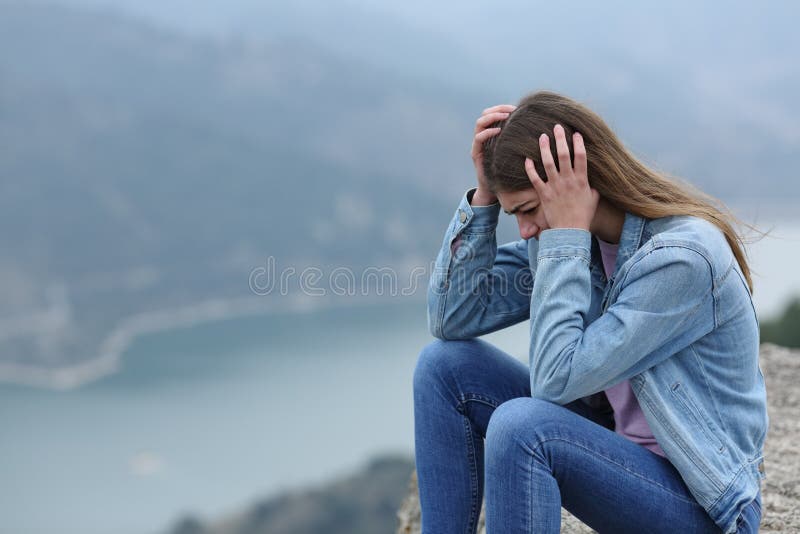 Sad Teen Complaining Alone in a Cliff Stock Image - Image of cliff ...