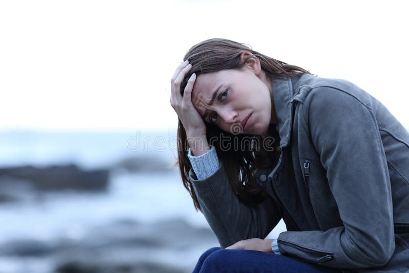Sad Teen Complaining Looking at Camera on the Beach Stock Photo - Image ...