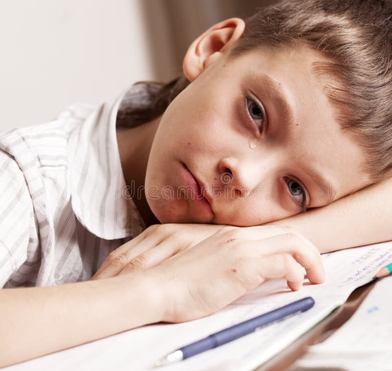 Sad teen doing homework stock image. Image of student - 95865035