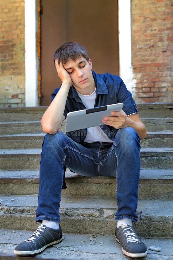 Sad Teenager with Tablet stock image. Image of phablet - 51179775