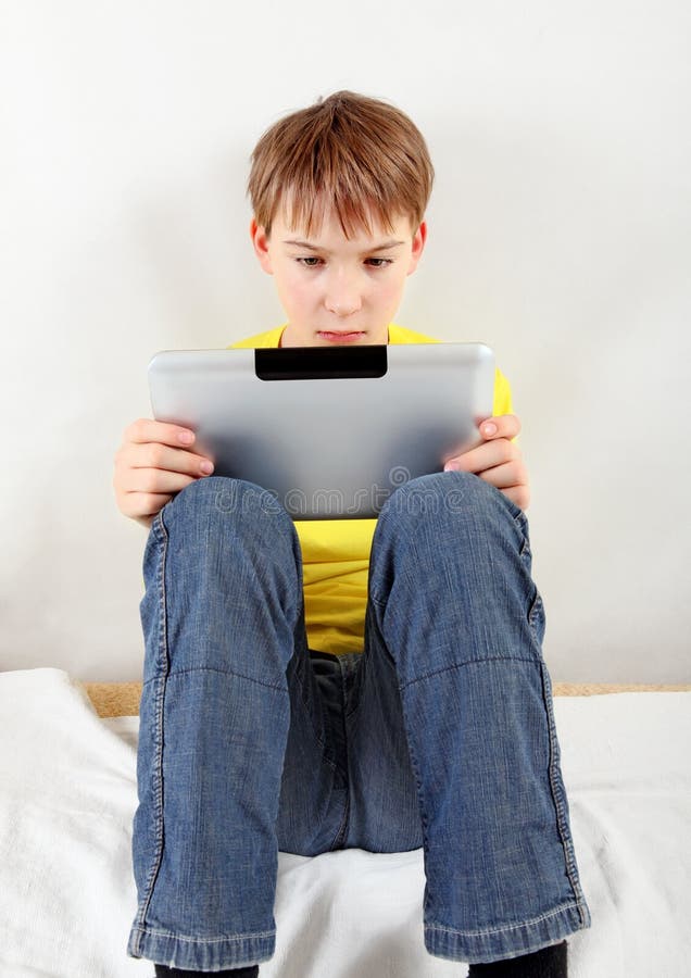 Sad Teenager with Tablet stock image. Image of gadget - 52103359