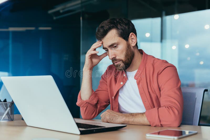 Sad and Thinking Programmer in Red Shirt Working on Laptop Inside ...