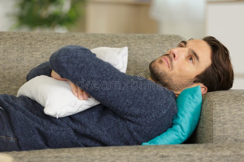 Sad Thoughtful Handsome Man Hugging Pillow Stock Image - Image of ...