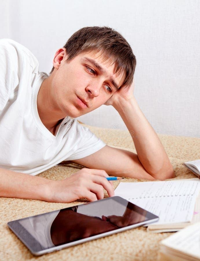 Student doing Homework stock image. Image of attractive - 63785593