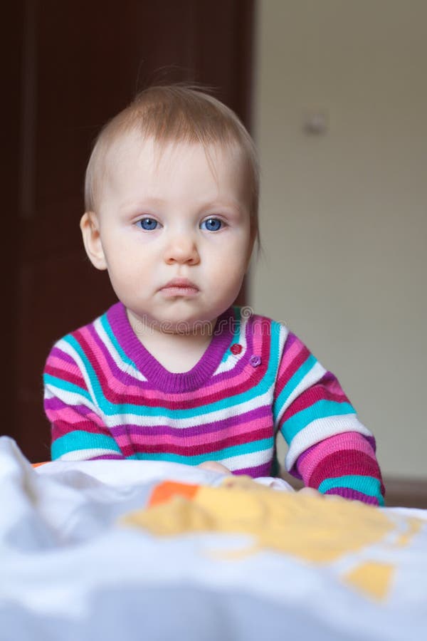 Sad and Very Serious Baby Girl Stock Photo - Image of closeup, striped ...