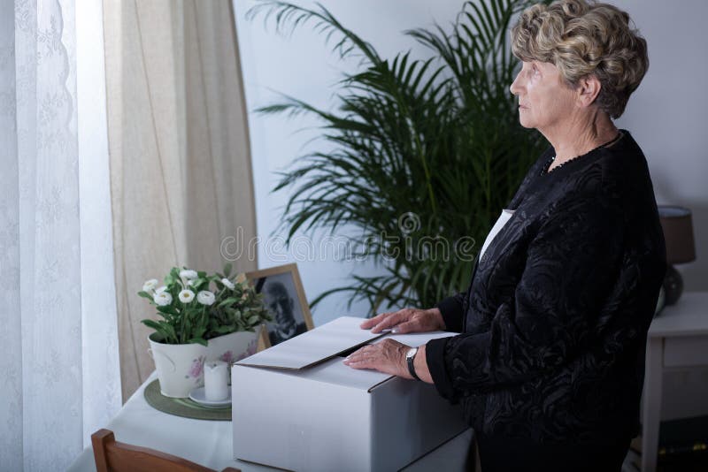 Sad widow holding box stock photo. Image of alone, loneliness - 62290424
