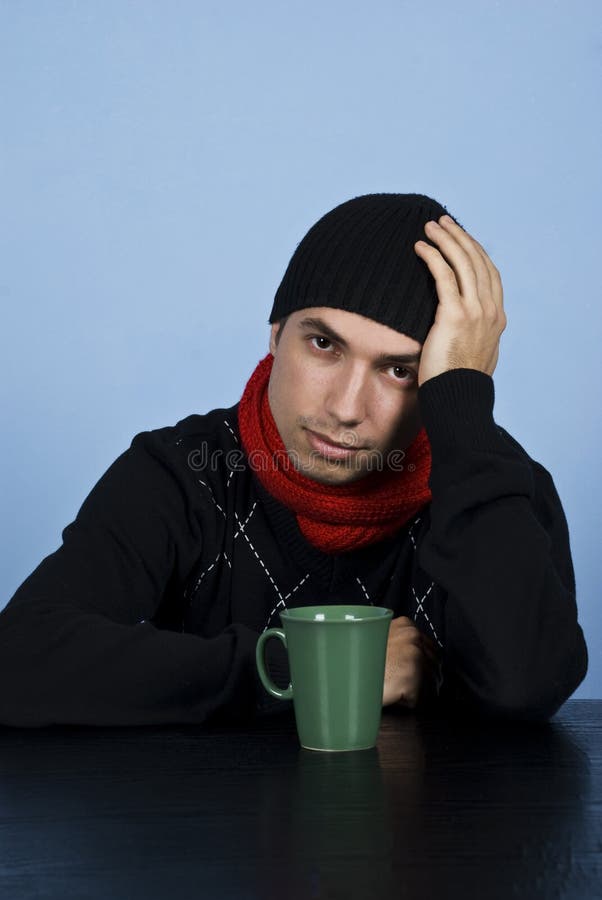 Sad winter man at table stock image. Image of expression - 12008189