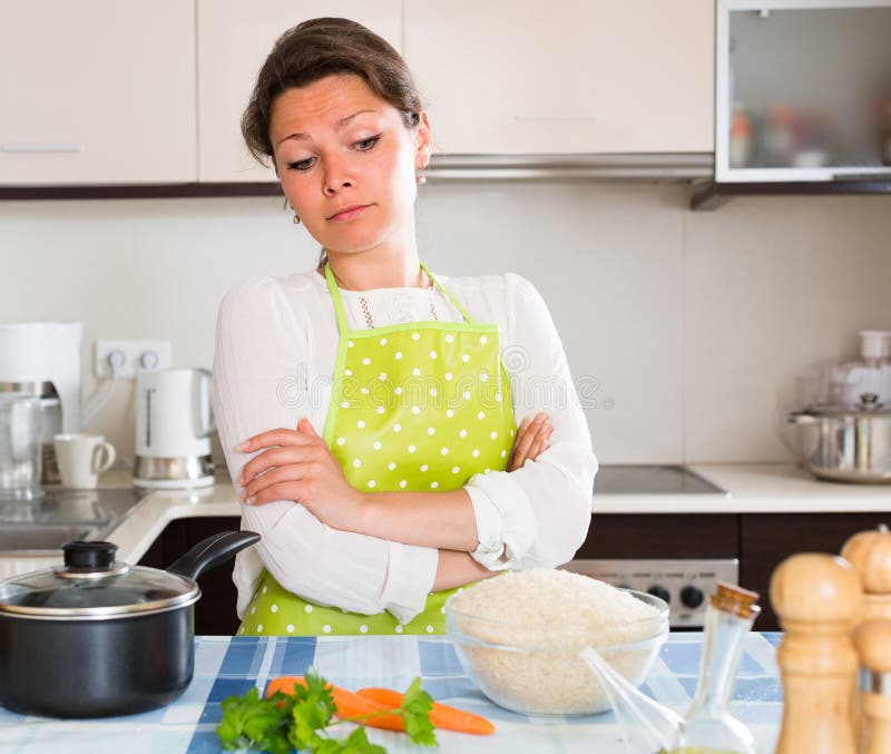 Sad Woman Cooking Rice in the Kitchen Stock Image - Image of domestic ...