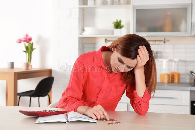 Sad woman counting money stock photo. Image of indoors - 144786980