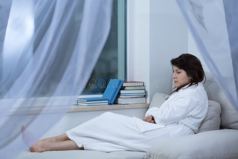 Sad woman in dressing gown stock photo. Image of pajamas - 53238602