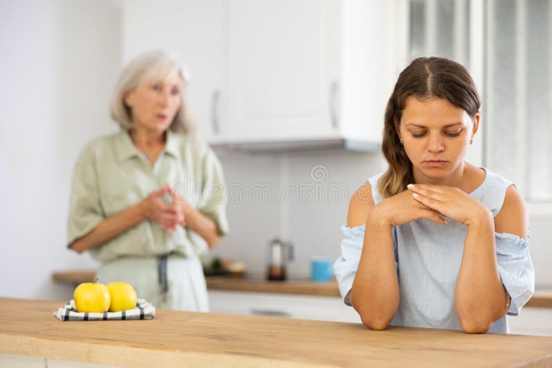 Sad Woman Ignoring Her Senior Mother Arguing With Her Stock Image