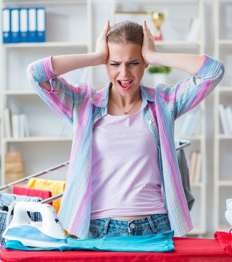 Sad Woman Ironing Clothing at Home Stock Photo - Image of ironing ...