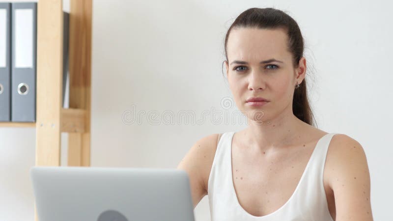 Sad Woman Looking at Camera at Work in Office Stock Image - Image of ...