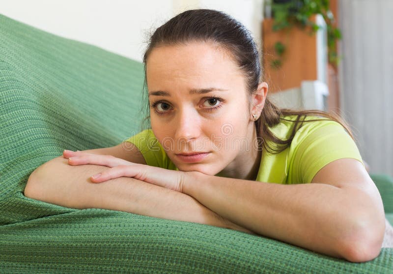Sad woman sitting at home stock photo. Image of adult - 56859714