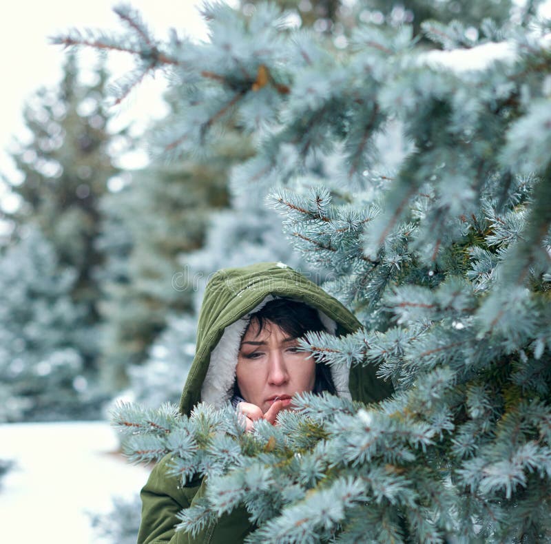 Sad Woman is Touching Fir Tree Branches in Winter Forest Stock Photo ...