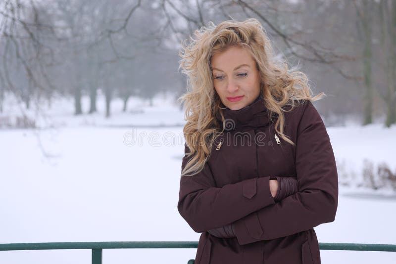 Sad woman in winter stock photo. Image of outdoor, park - 64713224