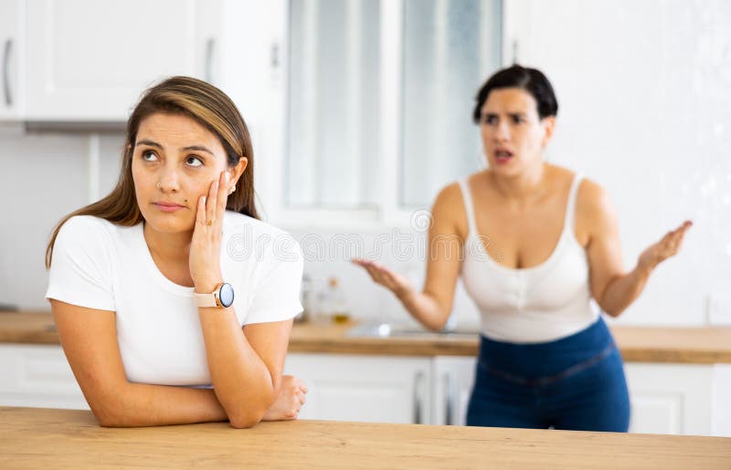 Woman Ignoring Her Girlfriend Standing In Background And Arguing With