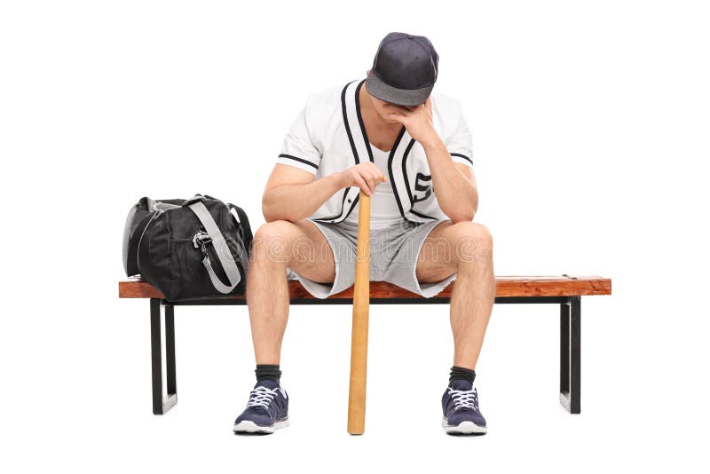 Sad Young Baseball Player Sitting On A Bench Stock Photo - Image: 53942208