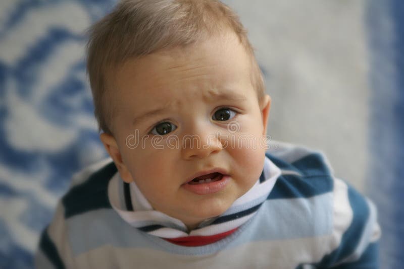 Sad young child stock photo. Image of colorful, blue, blanket - 4786786