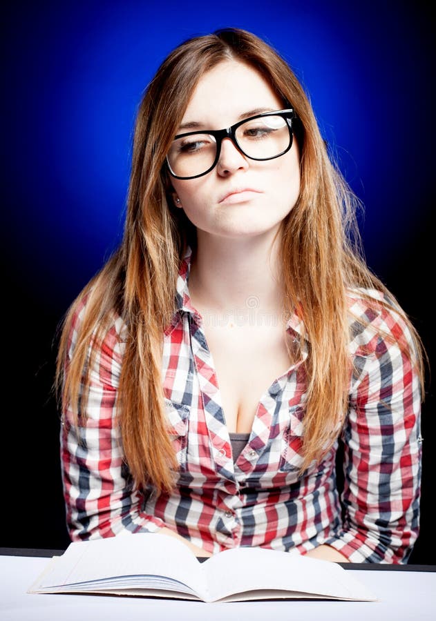 Sad Young Girl with Nerd Glasses and Open Exercise Book Stock Photo ...