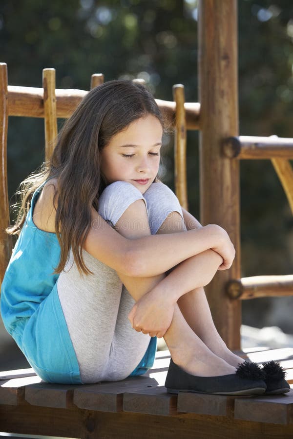 Sad Young Girl Sitting on Climbing Frame Stock Image - Image of bullied ...