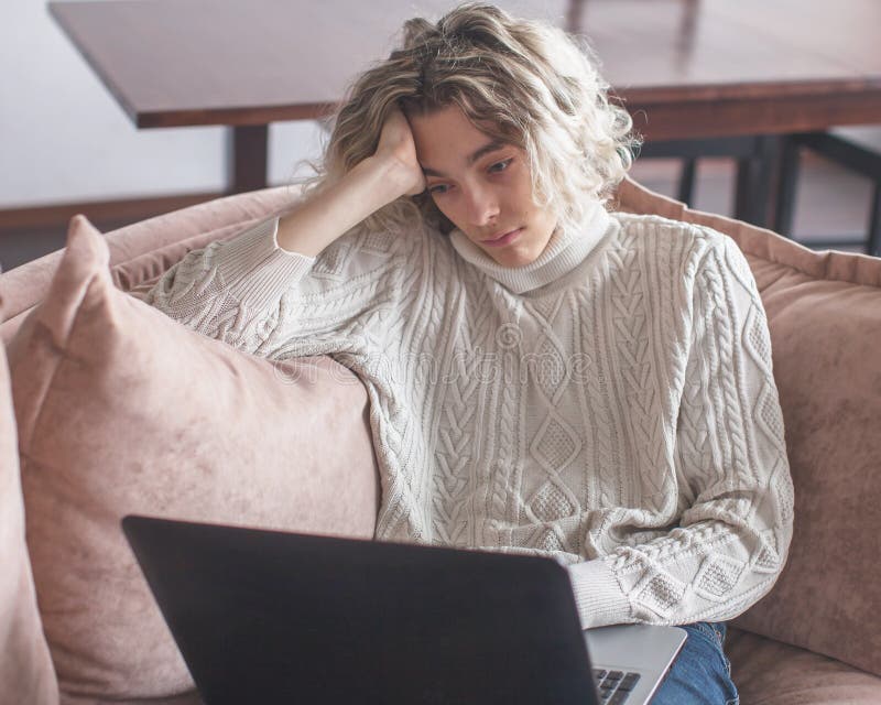 Sad Young Man on the Couch with Laptop Stock Photo - Image of problem ...