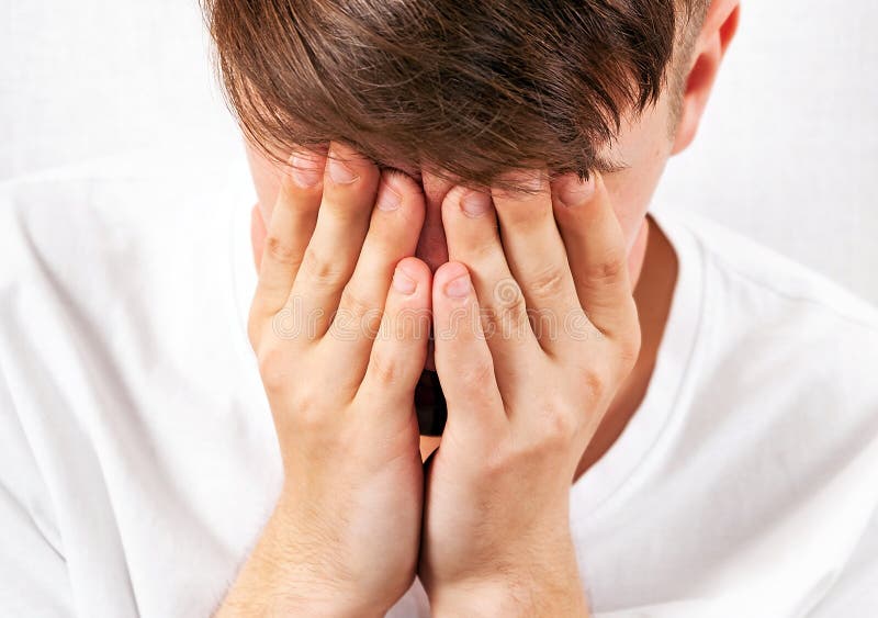 Sad Young Man is Crying stock photo. Image of alone - 309077184