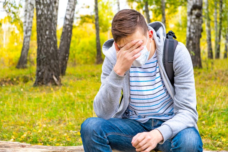 Sad Young Man in Flu Mask stock photo. Image of person - 230660012