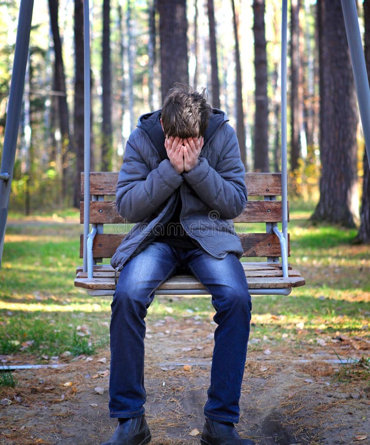 Sad Young Man outdoor stock image. Image of park, adult - 52476987
