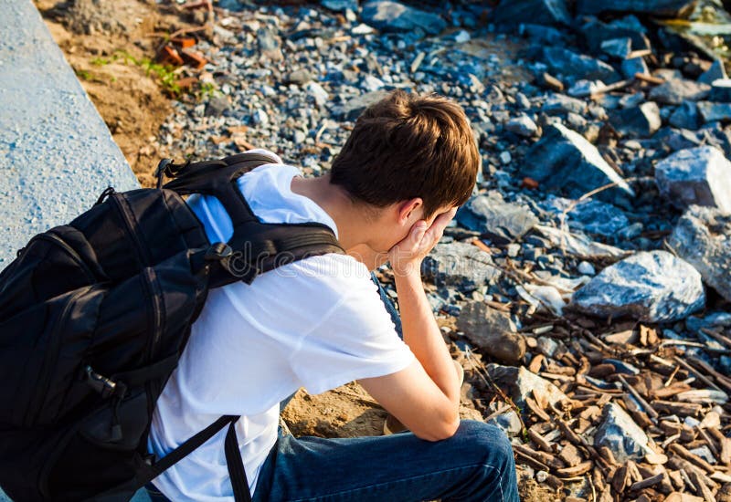 Sad Young Man outdoor stock photo. Image of rocks, side - 101489920