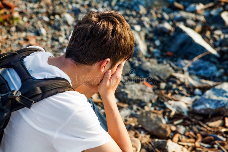 Sad Young Man outdoor stock photo. Image of outcast, sorrow - 98465298