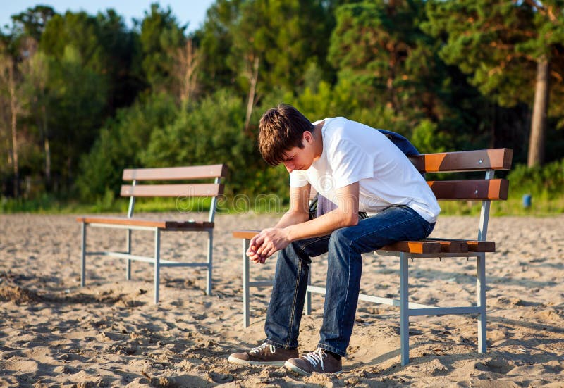 Sad Young Man outdoor stock photo. Image of lonesome - 267755084