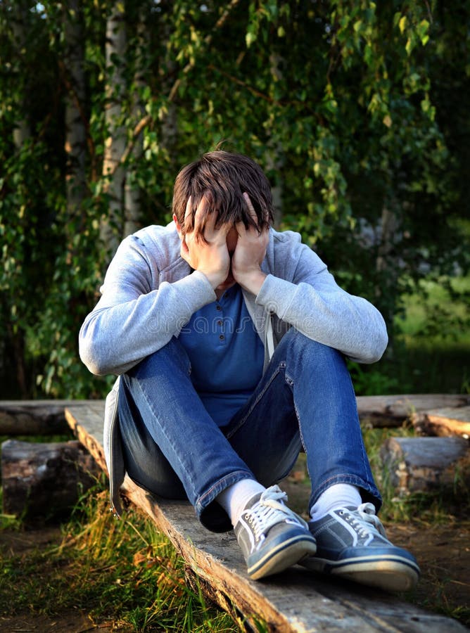 Sad Young Man outdoor stock photo. Image of despondent - 260197108