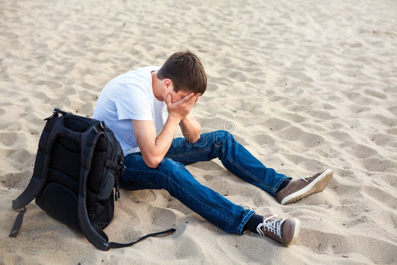 Sad Young Man stock image. Image of adult, sand, depression - 107673257