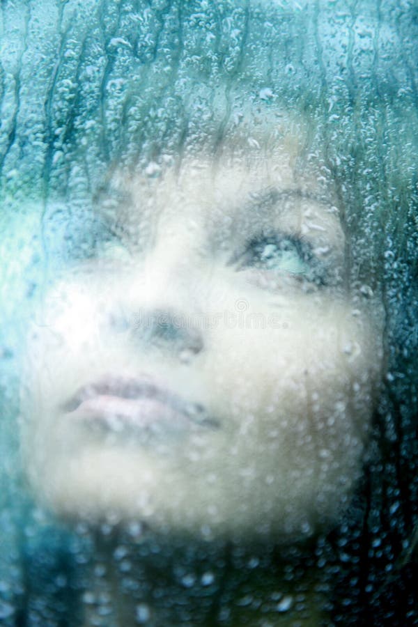 Woman and rainy window stock photo. Image of lifestyles - 12293634