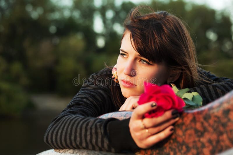 Sad Young Woman with a Rose Stock Photo - Image of eyes, face: 19939070
