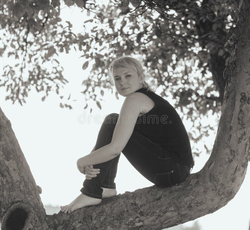 Sadness Girl Sitting on a Tree Branch Stock Photo - Image of relaxation ...