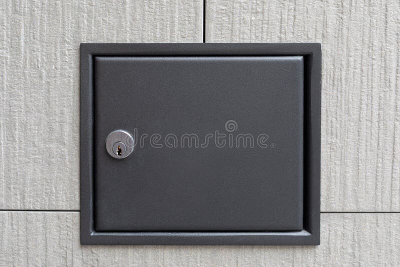 Safe Door is on Wall. Metal Door with a Keyhole on the Wall. Copy Space ...