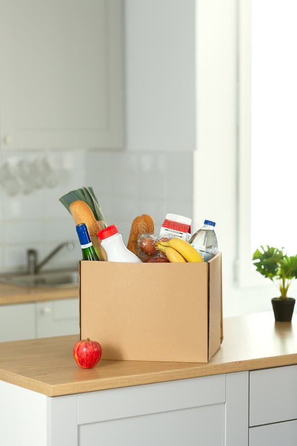 Safe Home Delivery. a Box of Food on the Modern Kitchen Stock Photo ...