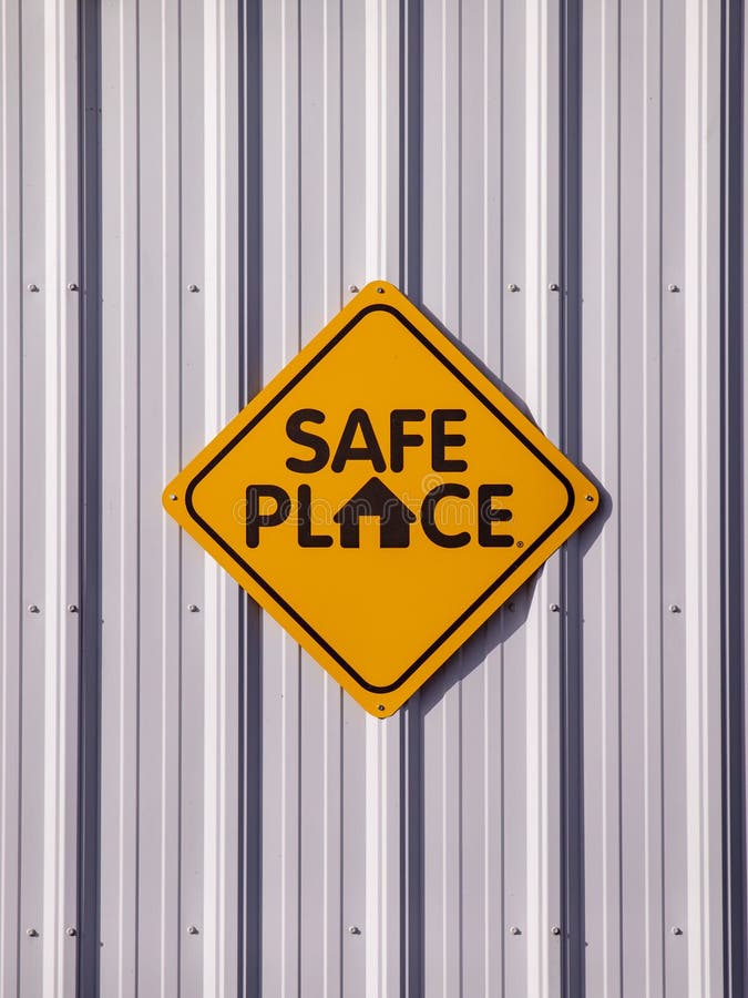 Yellow `Safe Place` Sign of a Light Metal Wall Stock Photo - Image of ...