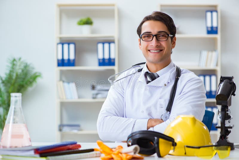 The Safety Doctor Advising about Wearing Hard Hat Stock Photo - Image ...