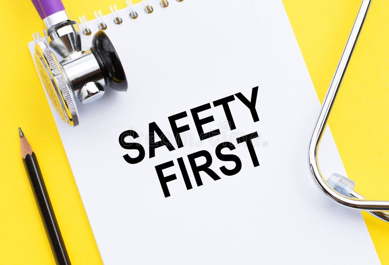 Safety First! Note with Pen and Stethoscope on Yellow Background Stock ...