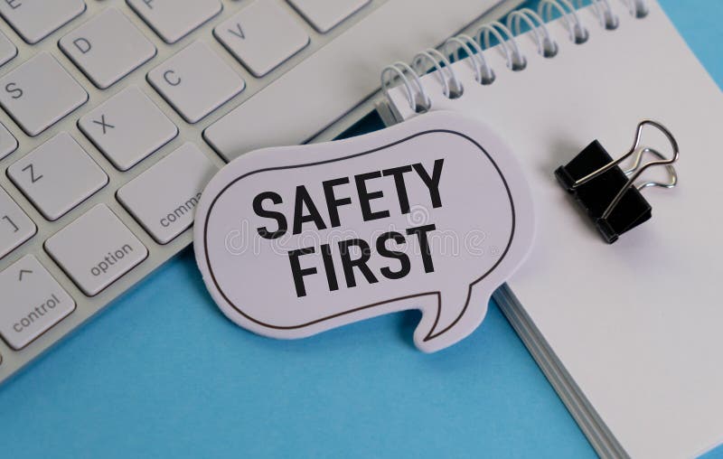 SAFETY FIRST Text on Paper on Notebook with Pen and Table on Keyboard ...