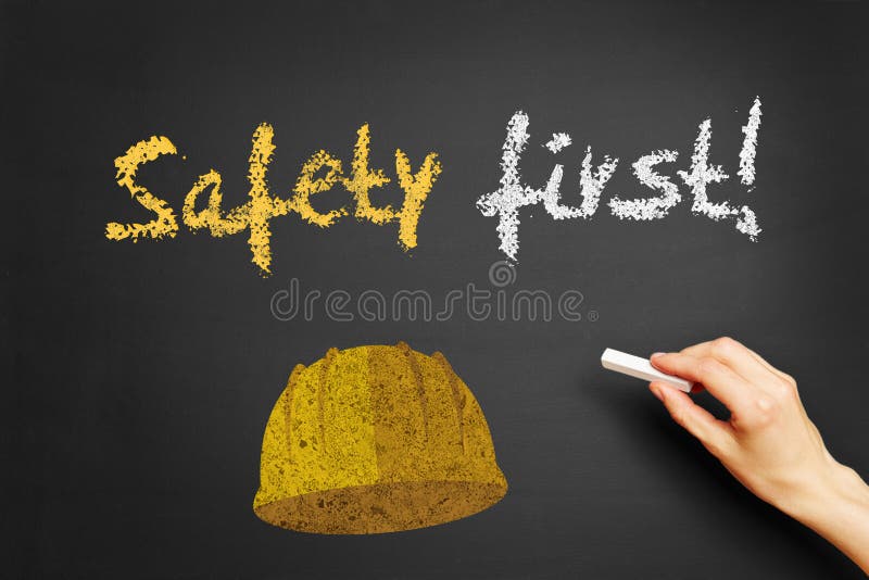 Safety First! Written on Blackboard Stock Image - Image of wearing ...