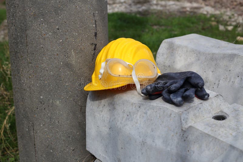 Yellow Helmet on a Work Site Stock Image - Image of protective, builder ...